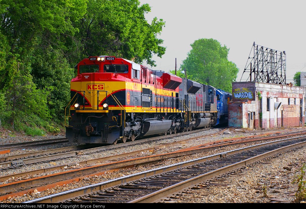 KCS 4031 leading freight past old KCS Cafe